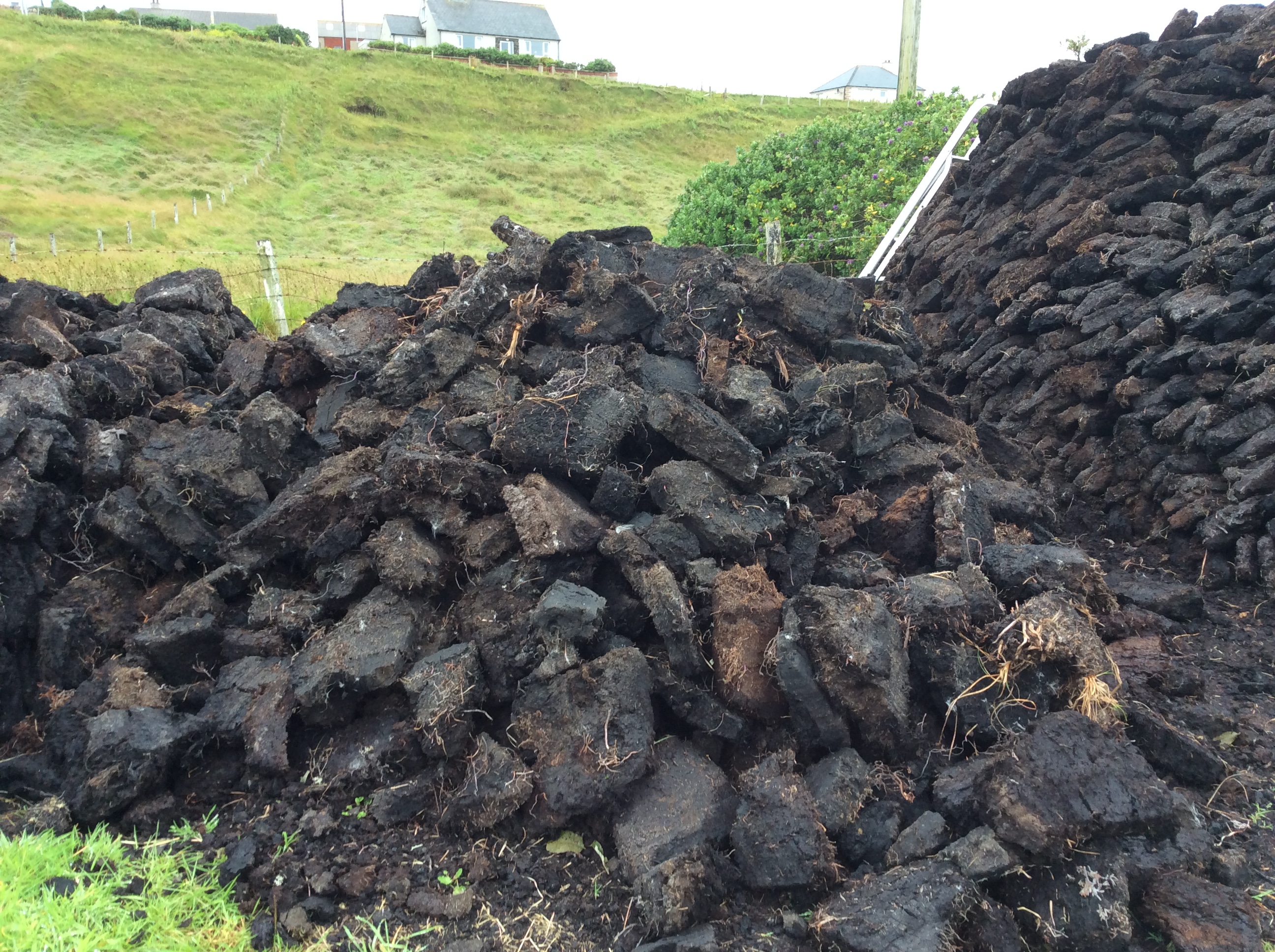 Stacking the peat. – Robin A Crawford